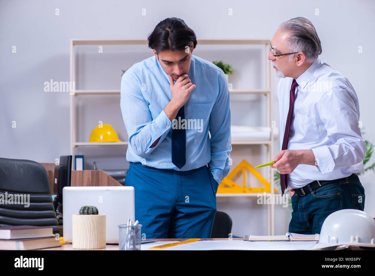 Two architects working on the project Stock Photo - Alamy
