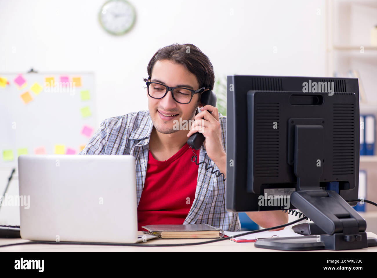 Male it specialist working in the office Stock Photo - Alamy