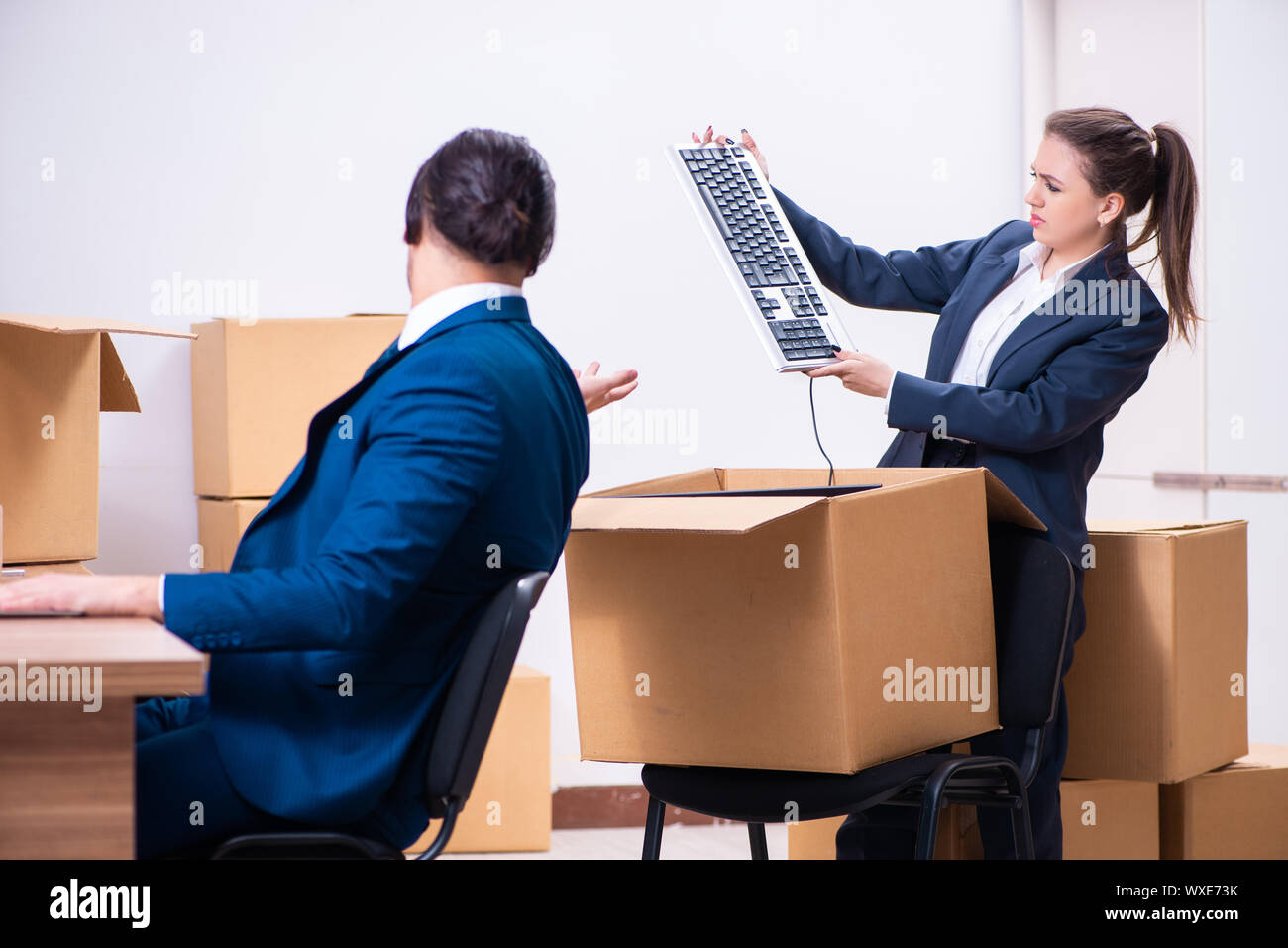 Two employees being fired from their work Stock Photo - Alamy