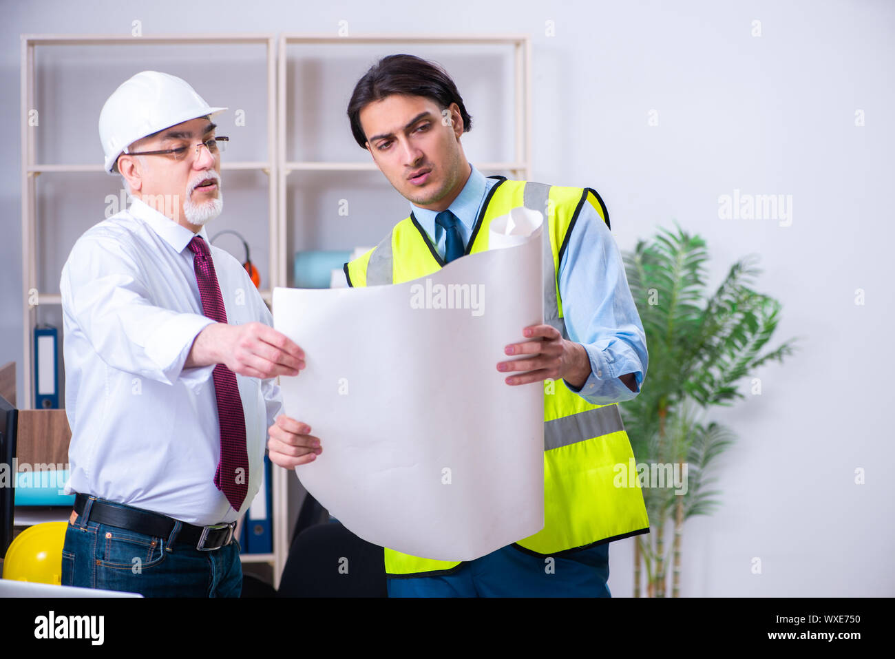 Two architects working on the project Stock Photo - Alamy