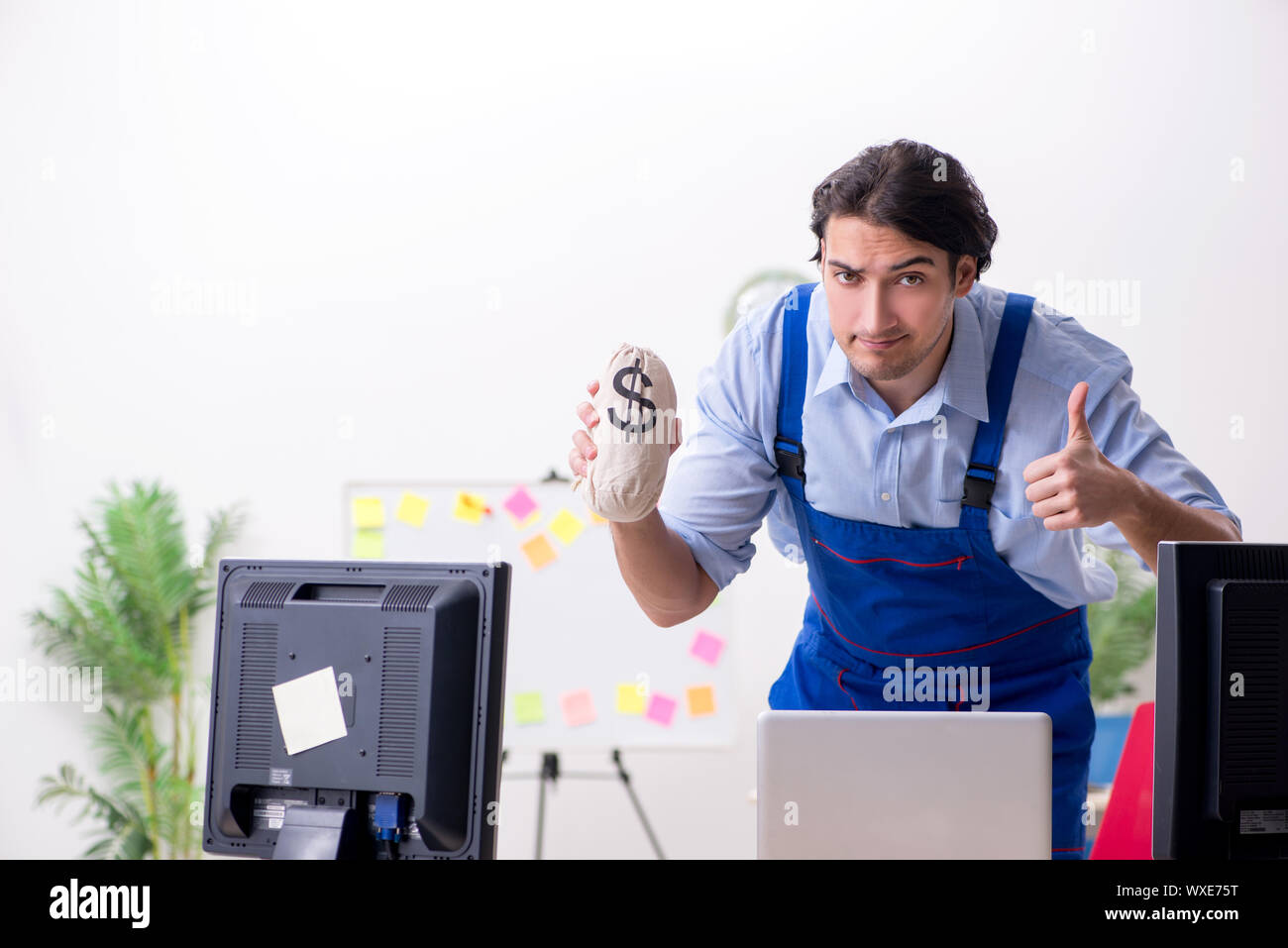 Male it specialist working in the office Stock Photo - Alamy