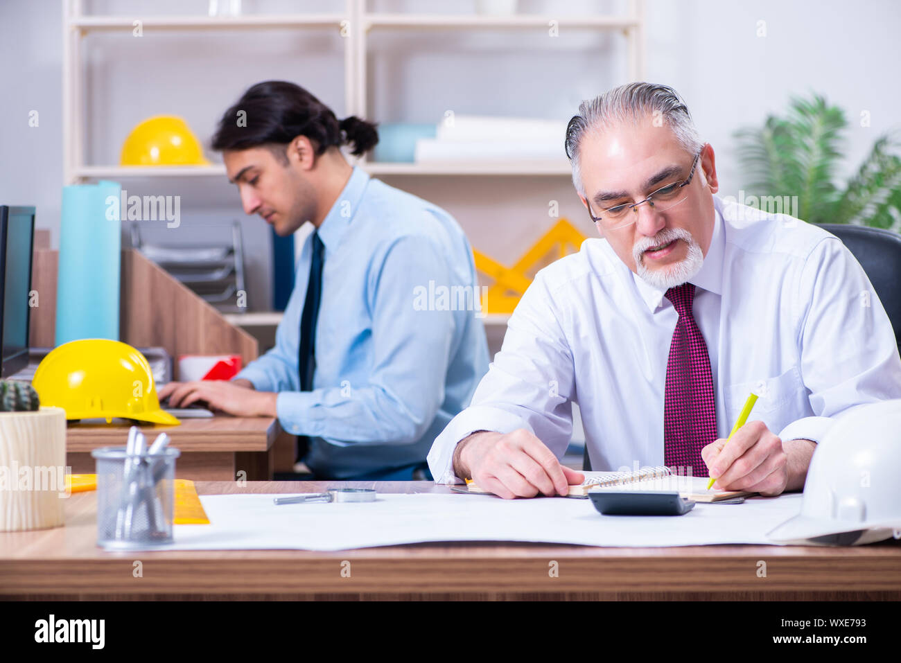 Two architects working on the project Stock Photo - Alamy