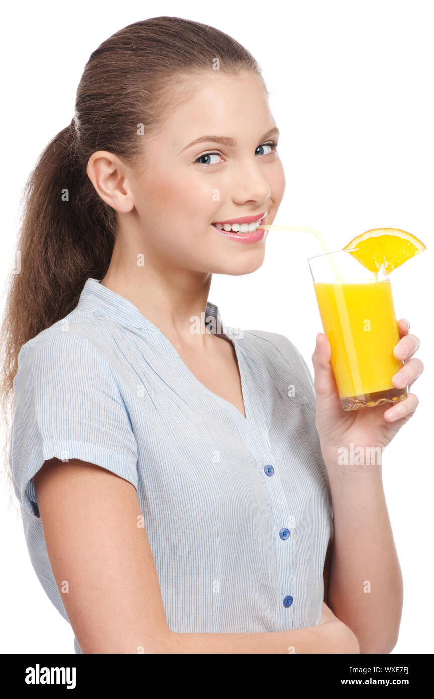 Pretty young woman with glass of orange juice isolated on the white ...