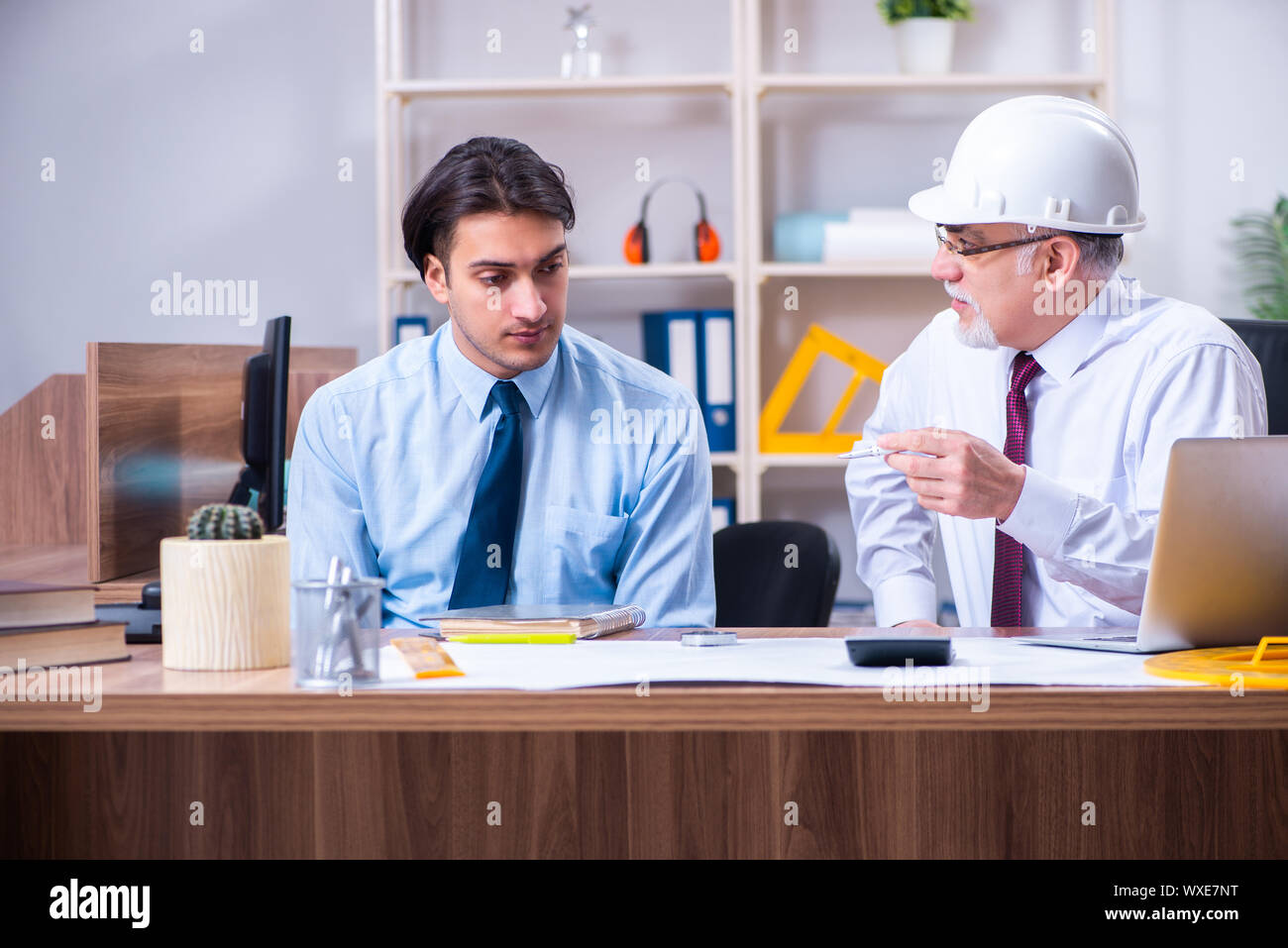 Two architects working on the project Stock Photo - Alamy