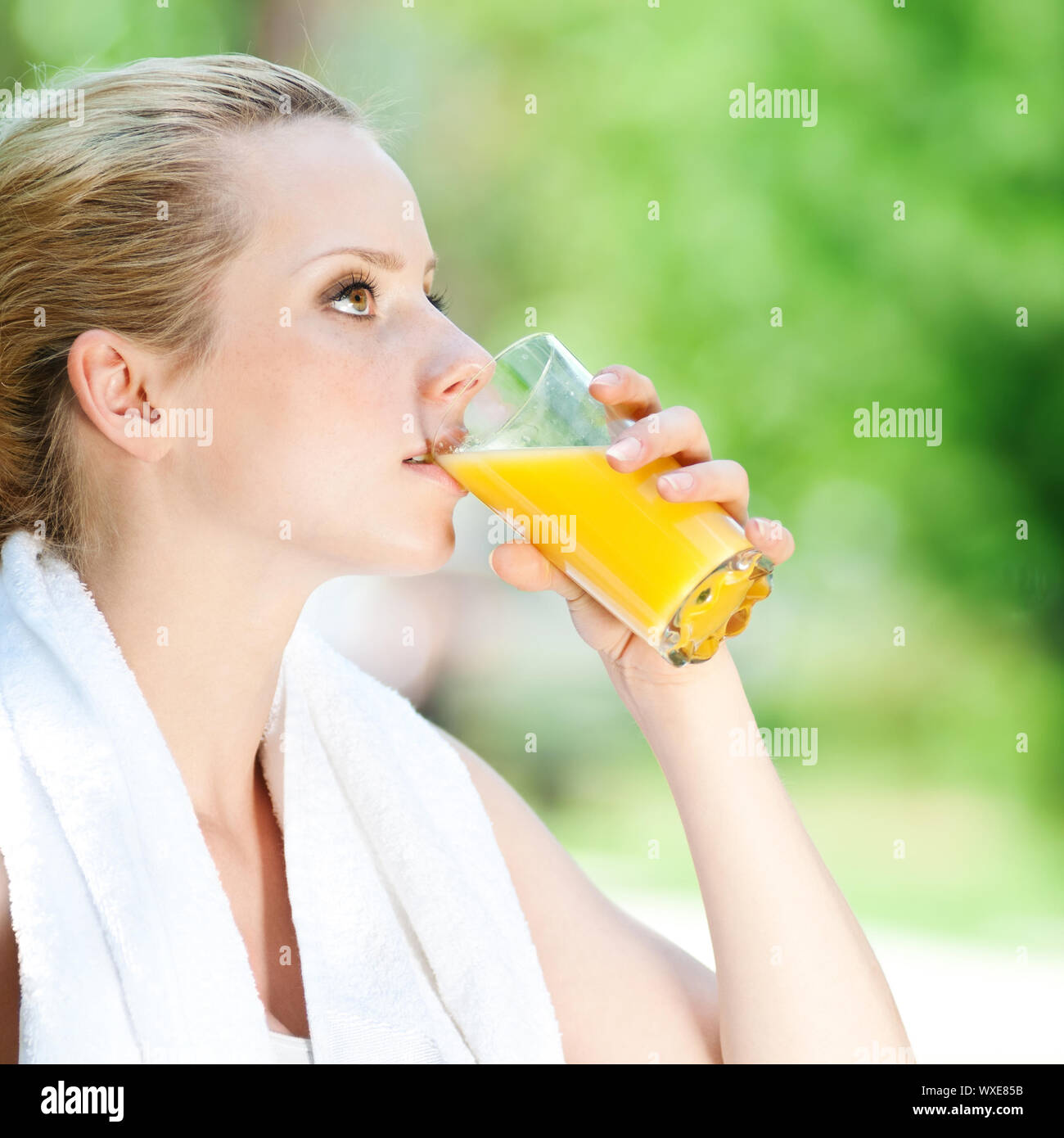 Woman drinking juice after exercise hi-res stock photography and images ...