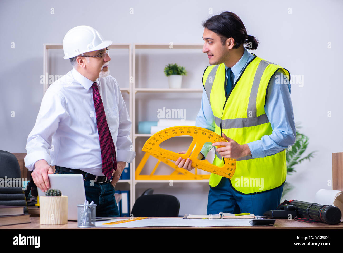 Two architects working on the project Stock Photo - Alamy