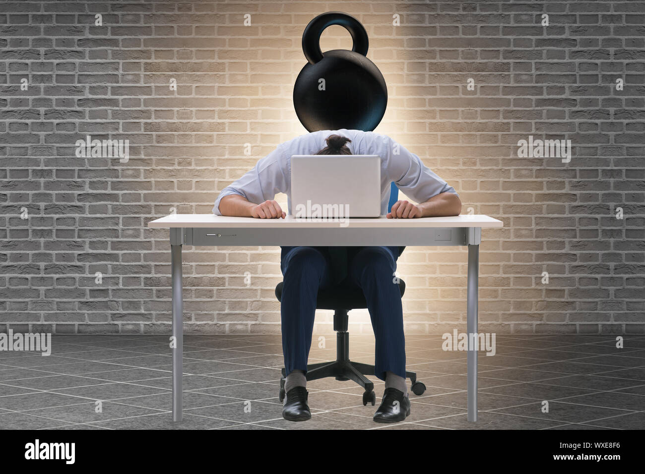 Employee with burden of work Stock Photo - Alamy