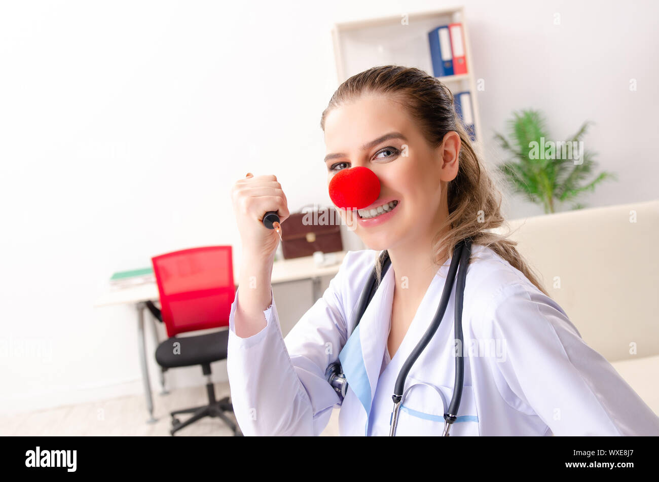 Funny female doctor working in the clinic Stock Photo - Alamy