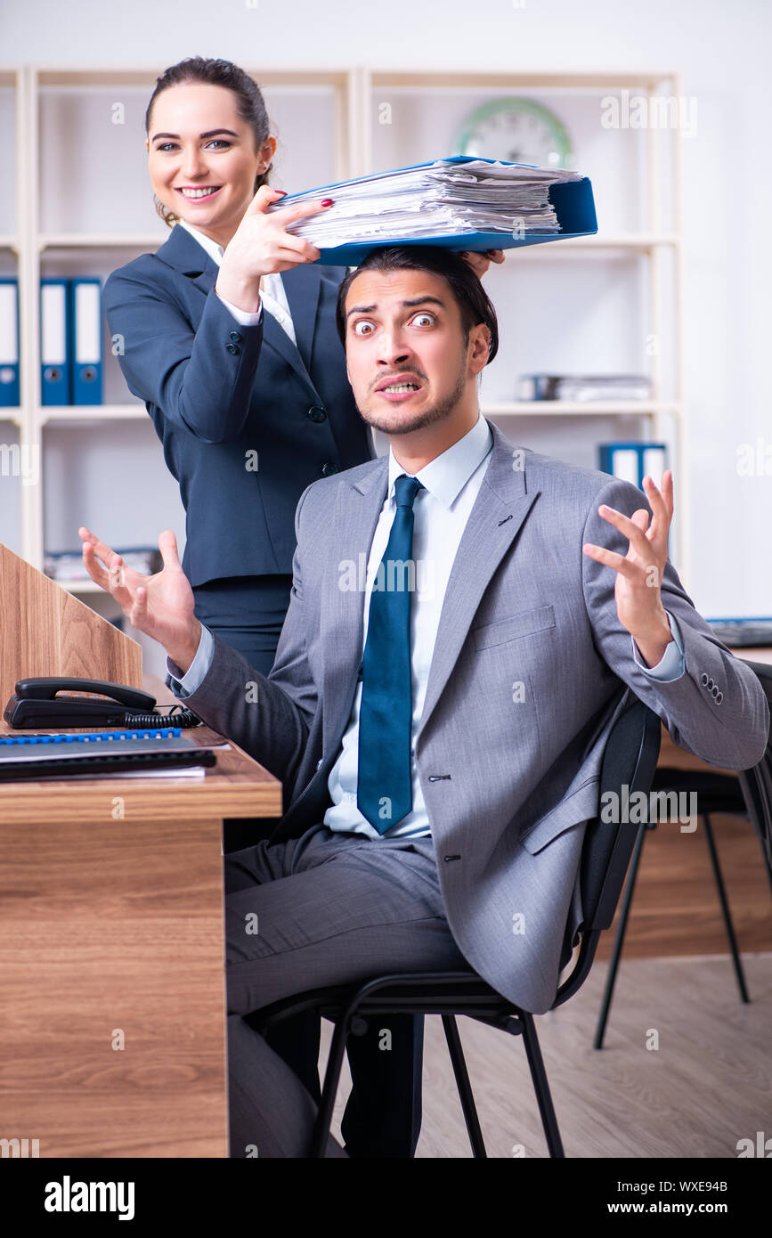 Two employees working in the office Stock Photo - Alamy