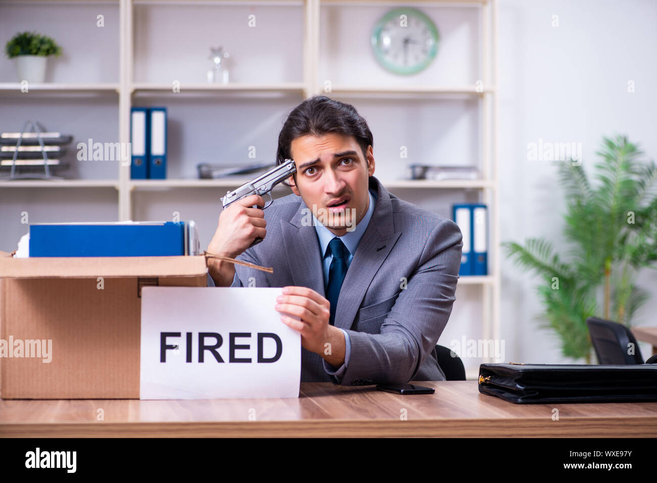 Young male employee being fired from his work Stock Photo - Alamy
