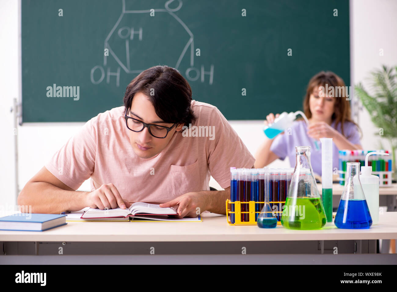 Two chemists students in classroom Stock Photo - Alamy