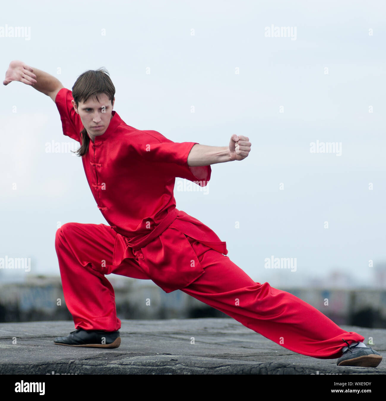 Shaolin warriors wushoo man in red practice martial art outdoor. Kung ...