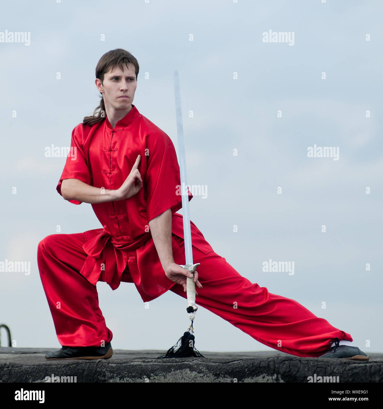Shaolin warriors wushoo man in red with sword practice martial art ...