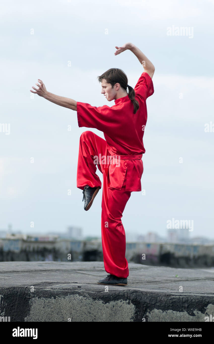 Shaolin warriors wushoo man in red practice martial art outdoor. Kung ...