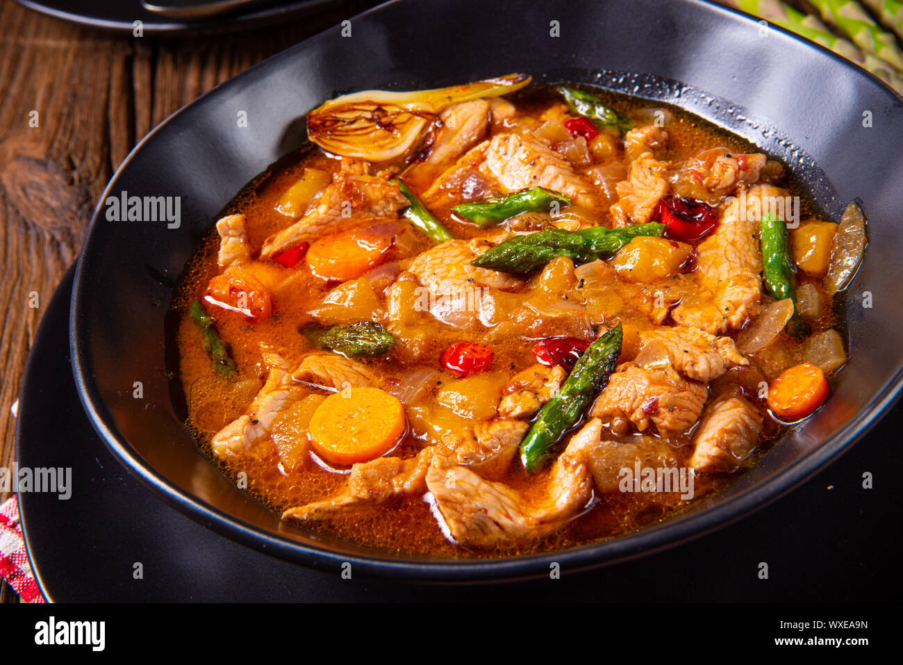 colorful turkey fricassee with asparagus and paprika Stock Photo - Alamy