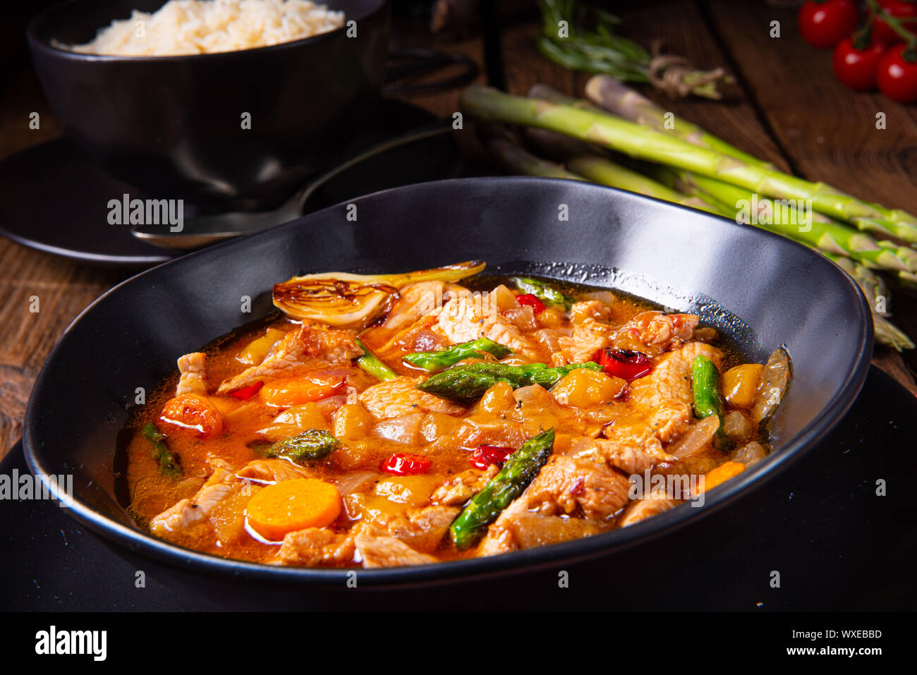 colorful turkey fricassee with asparagus and paprika Stock Photo - Alamy