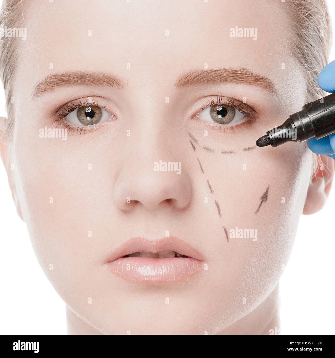 Beautician touch and draw correction lines on woman face. Before ...