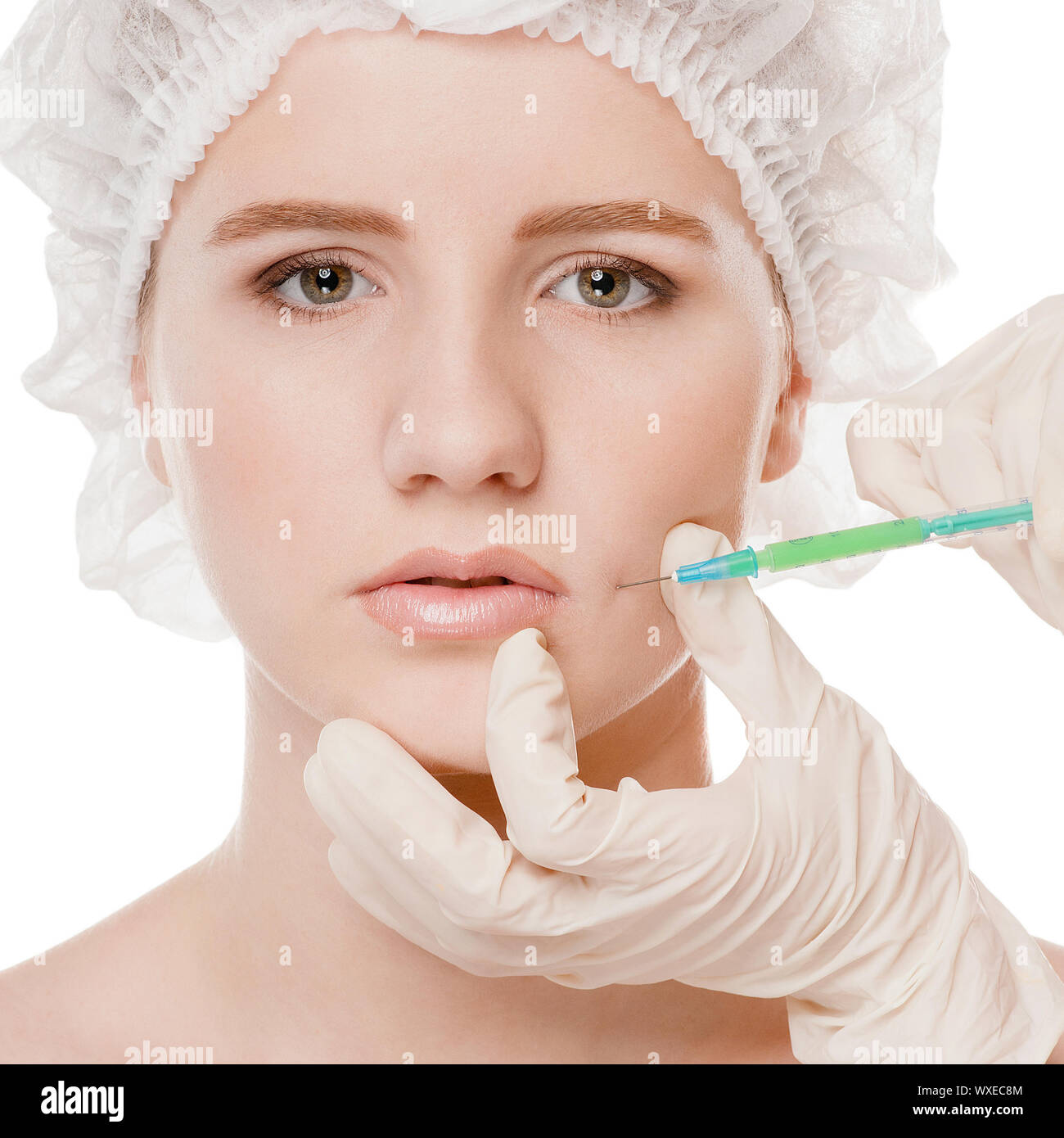 Cosmetic botox injection in the female face. Lips and cheek zone ...