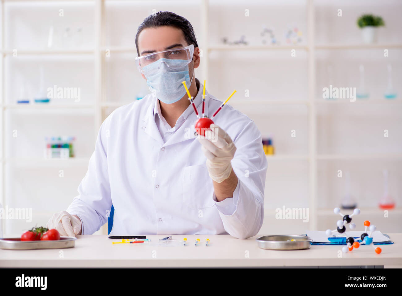 Male nutrition expert testing food products in lab Stock Photo - Alamy
