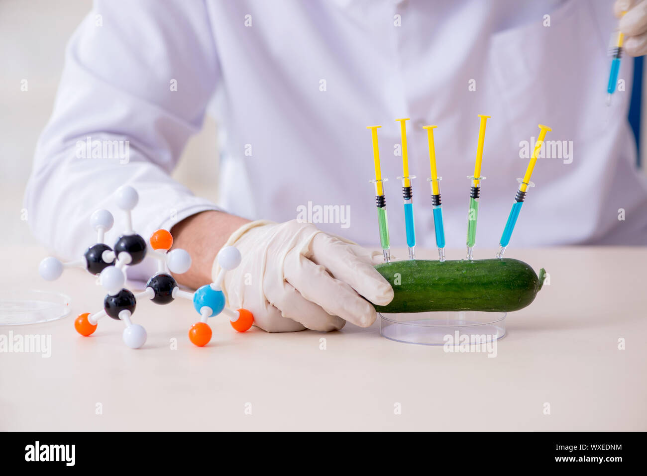 Male nutrition expert testing food products in lab Stock Photo - Alamy