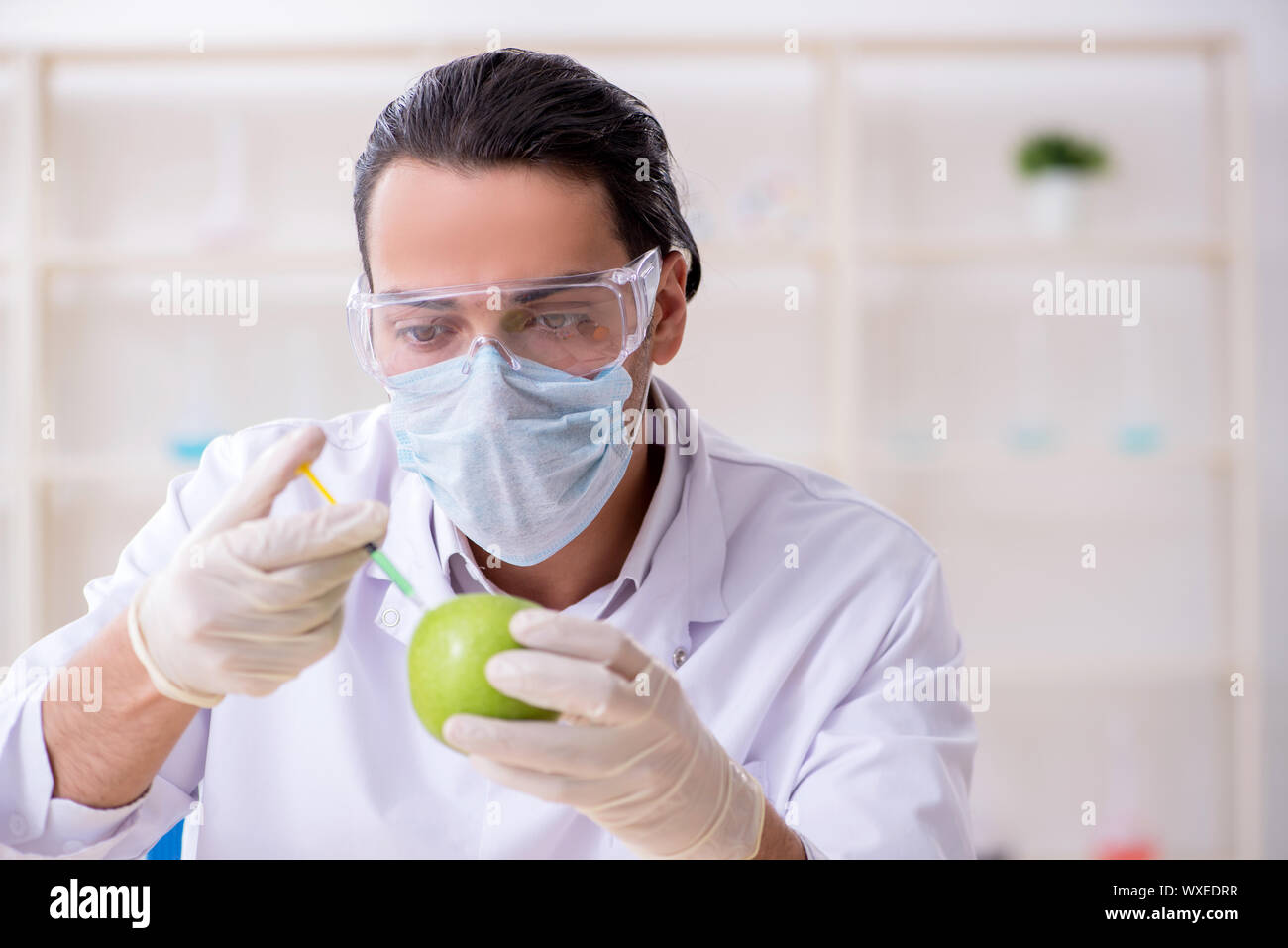 Male nutrition expert testing food products in lab Stock Photo - Alamy