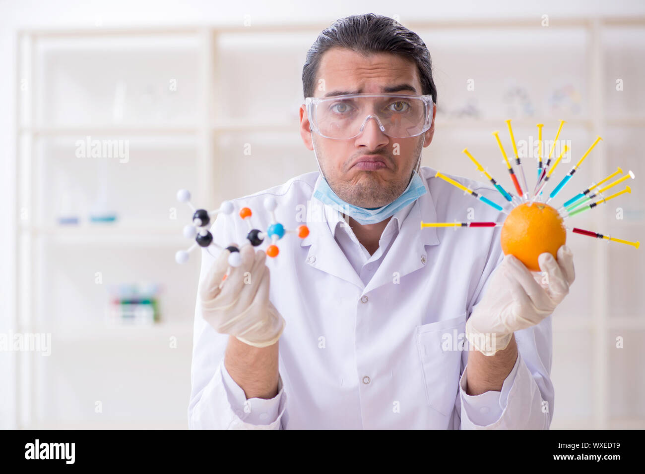 Male nutrition expert testing food products in lab Stock Photo - Alamy