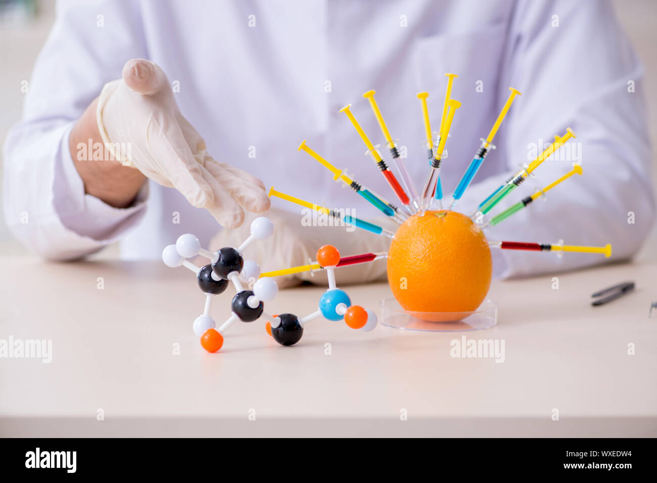 Male nutrition expert testing food products in lab Stock Photo - Alamy