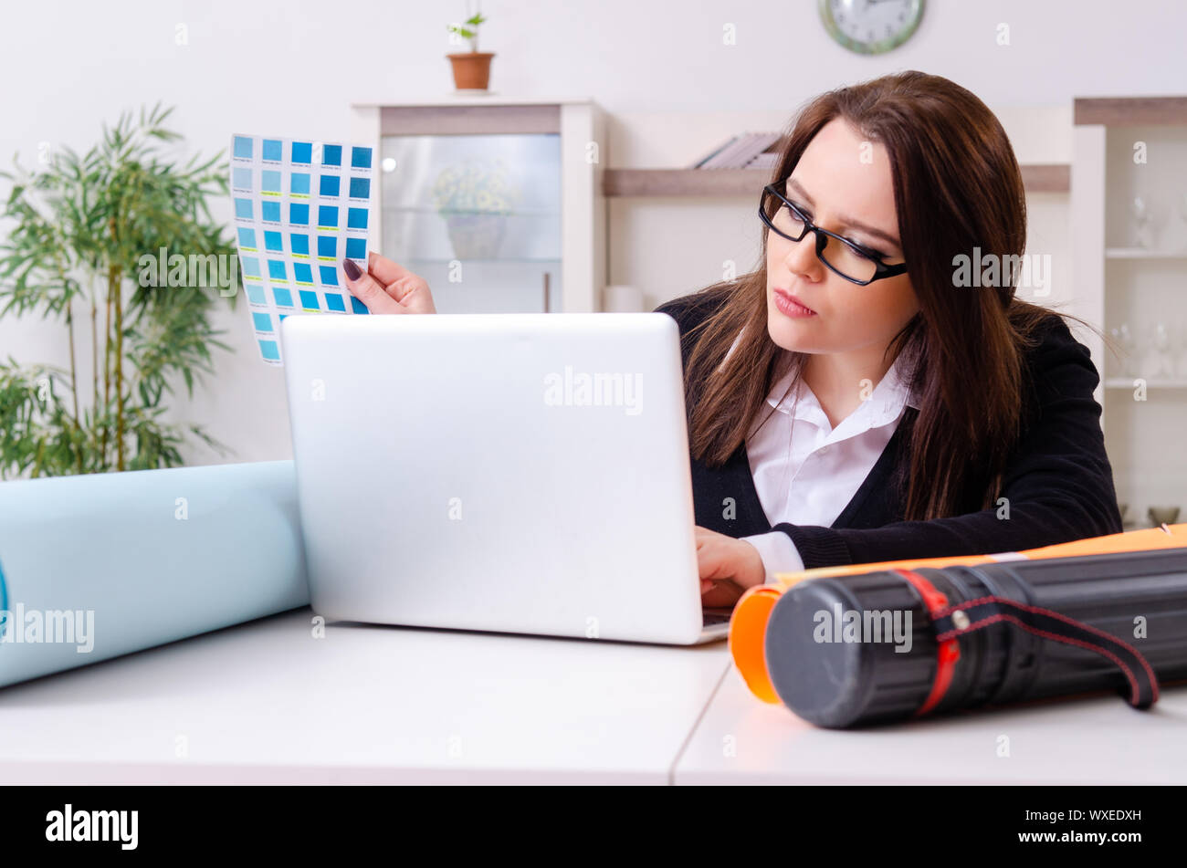 Female designer working in the office Stock Photo - Alamy