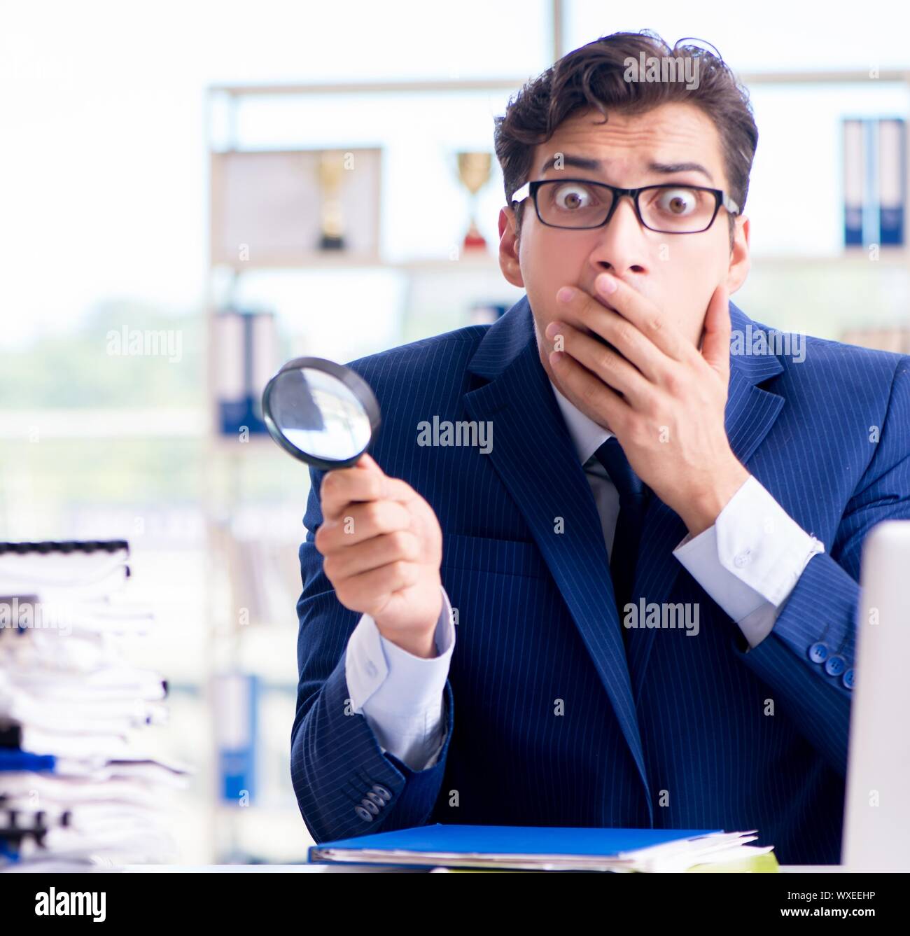 Auditor looking for errors in the financial statements Stock Photo - Alamy