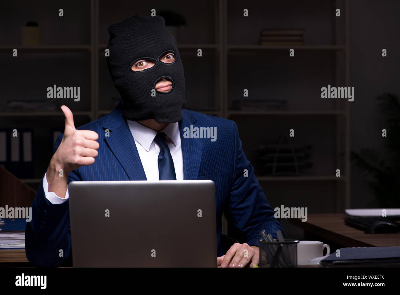 Male employee stealing information in the office night time Stock Photo ...