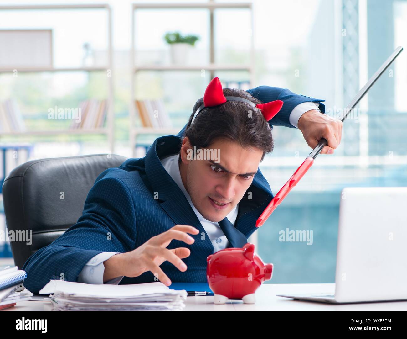 Devil angry businessman in the office Stock Photo - Alamy