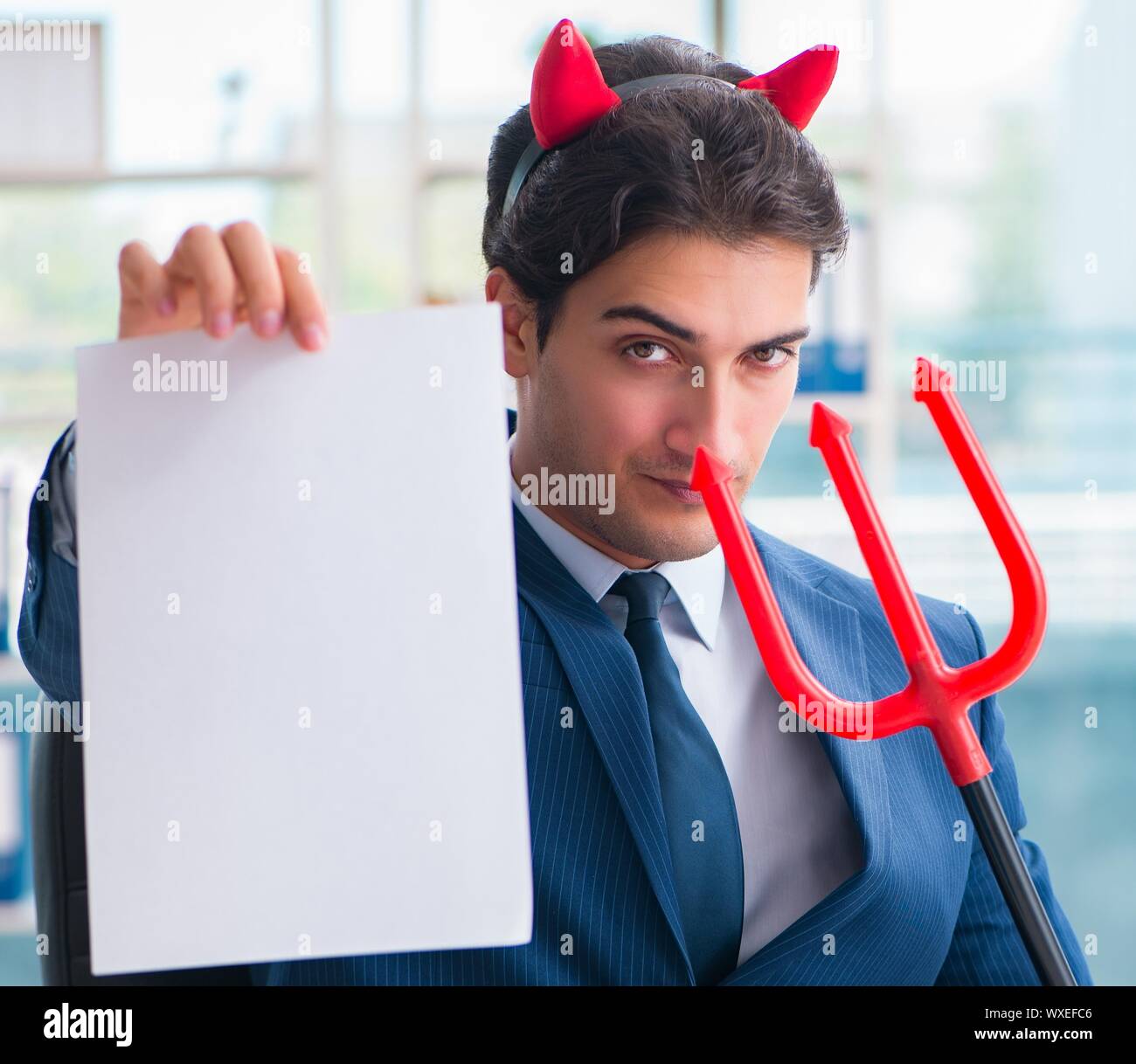 Devil angry businessman in the office Stock Photo - Alamy