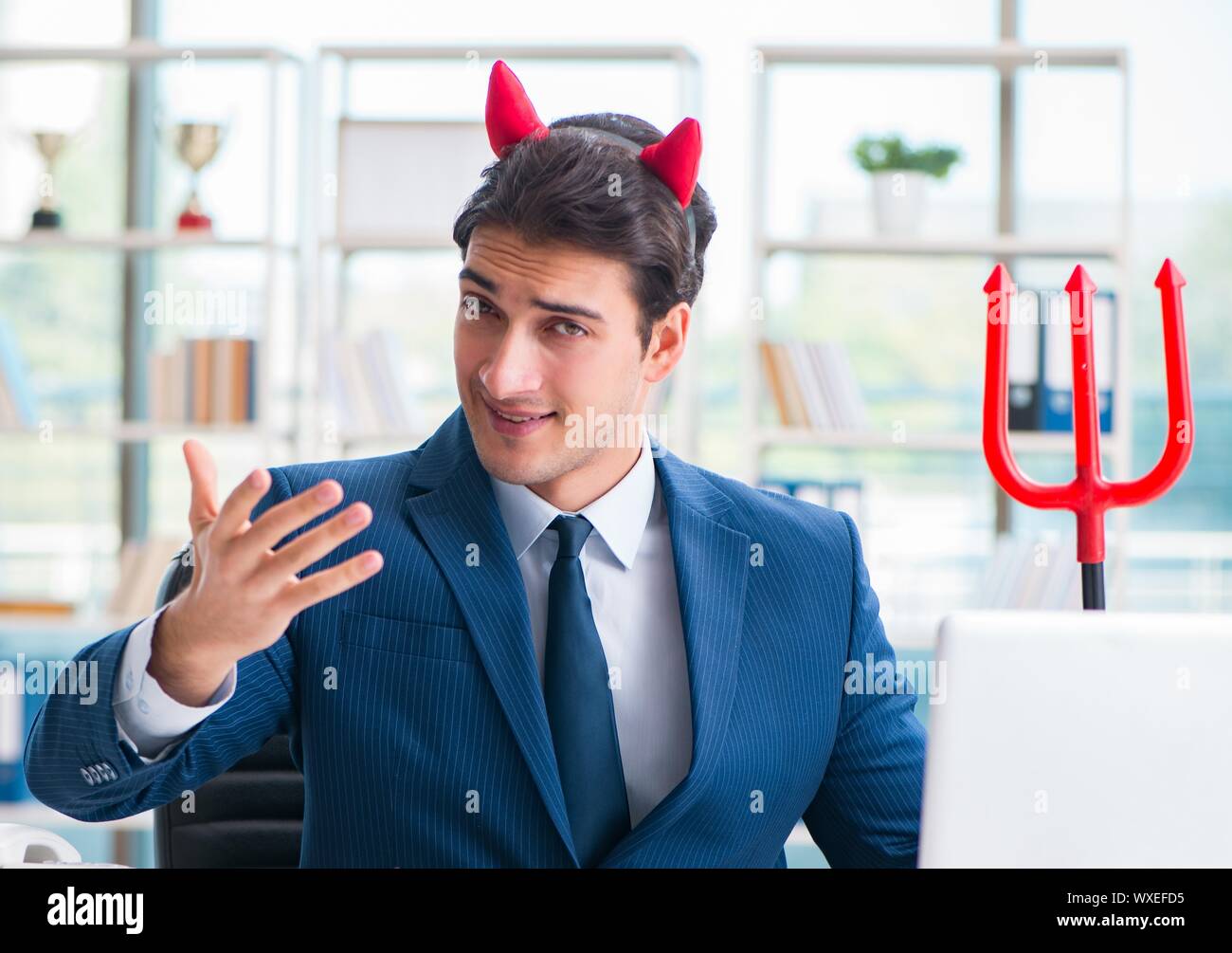 Devil angry businessman in the office Stock Photo - Alamy