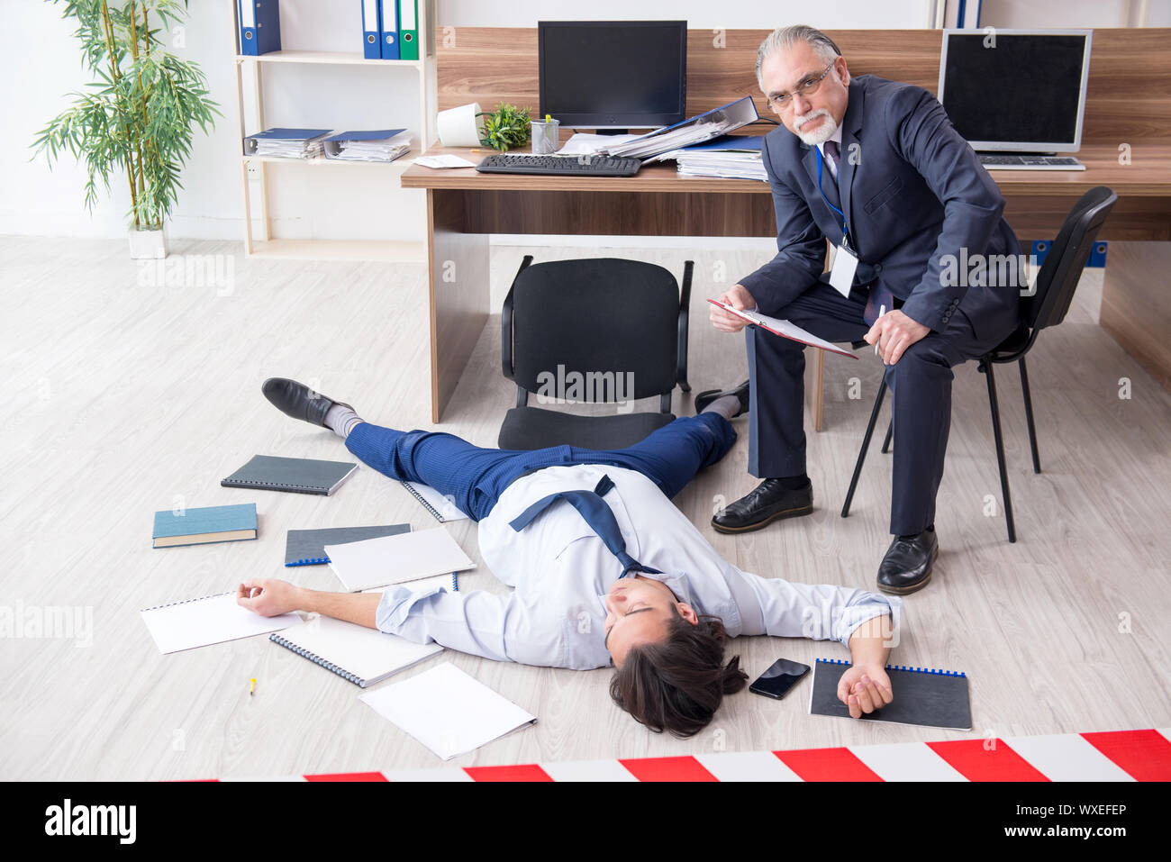 Forensic investigator and dead employee in the office Stock Photo - Alamy