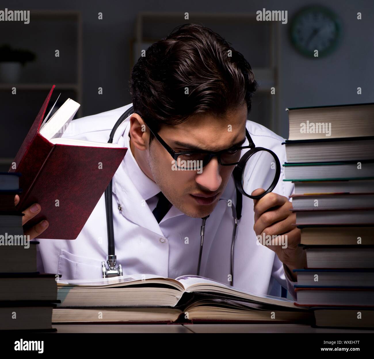 Medical student preparing for university exams at night Stock Photo - Alamy