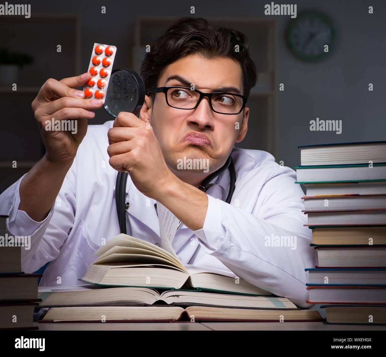 Medical student preparing for university exams at night Stock Photo - Alamy