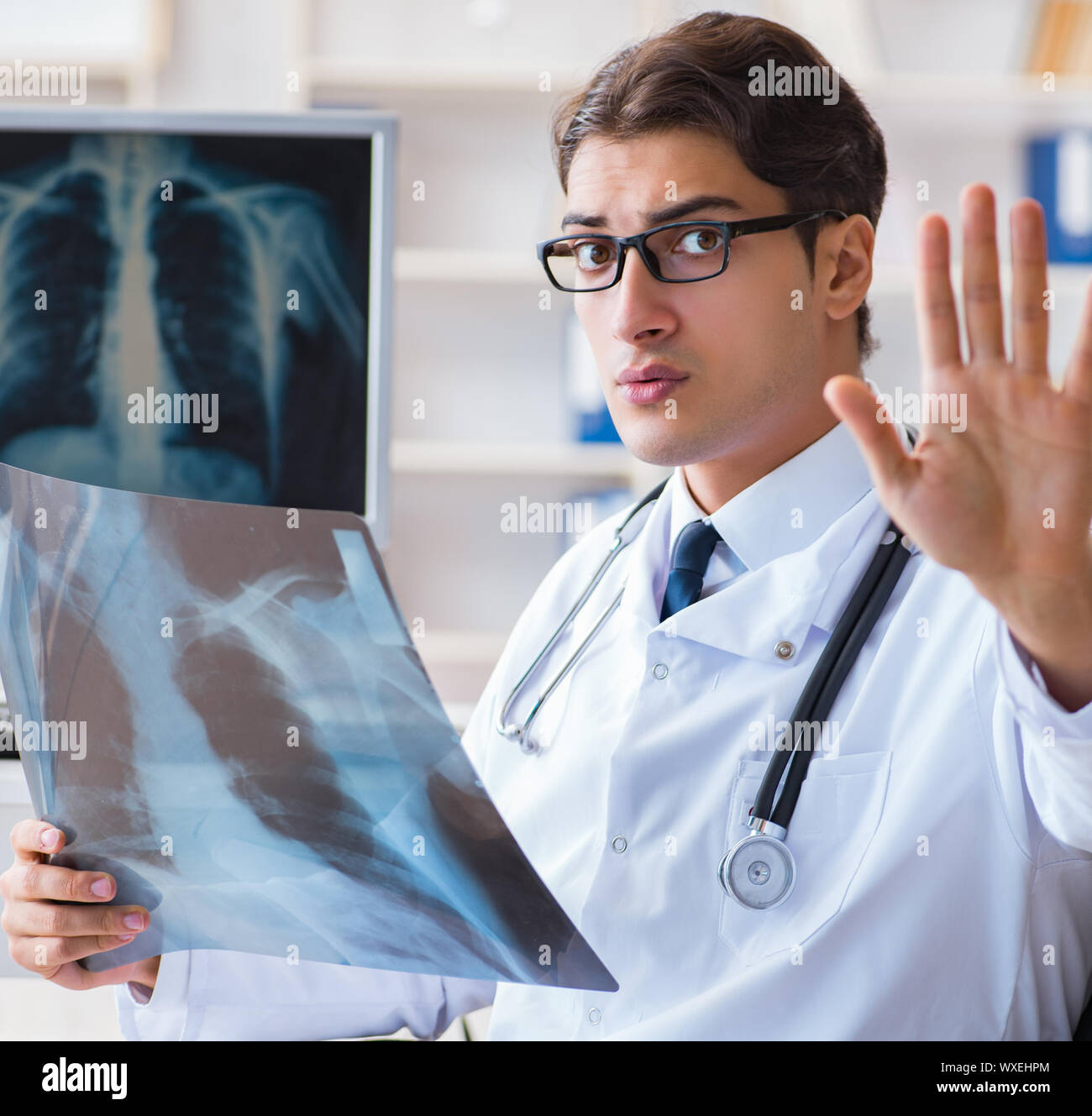 Doctor radiologist looking at x-ray images Stock Photo - Alamy