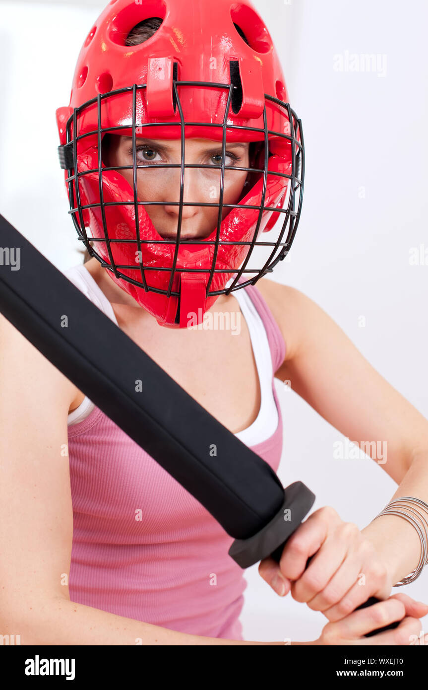 Beautiful sport woman doing self defence exercise at sport gym. Hit ...