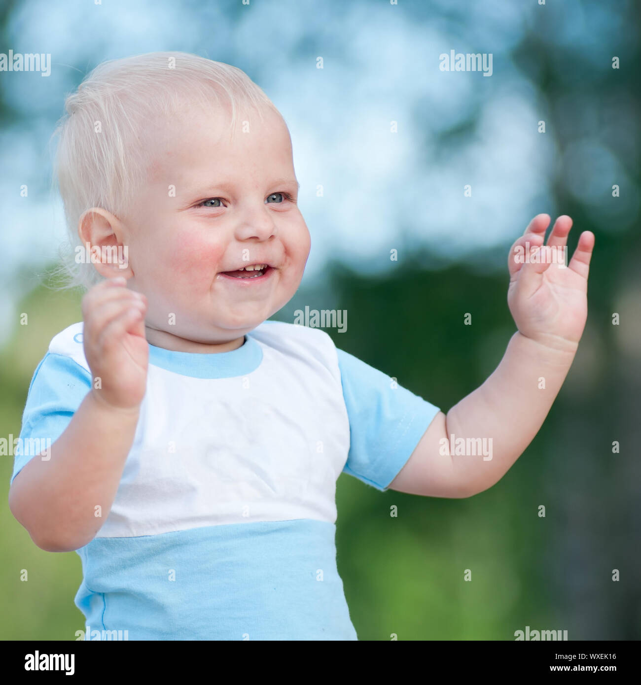 Portrait of a happy little boy in the green nature park. Outdoor Stock ...