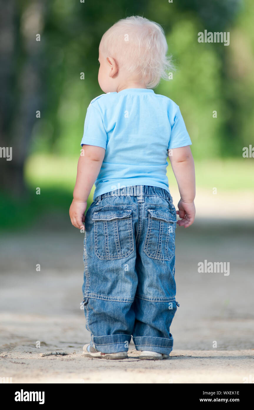 Portrait of a happy little boy in the green nature park. Outdoor Stock ...