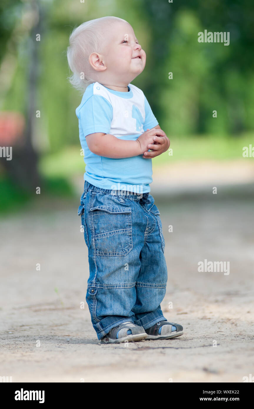 Portrait of a happy little boy in the green nature park. Outdoor Stock ...