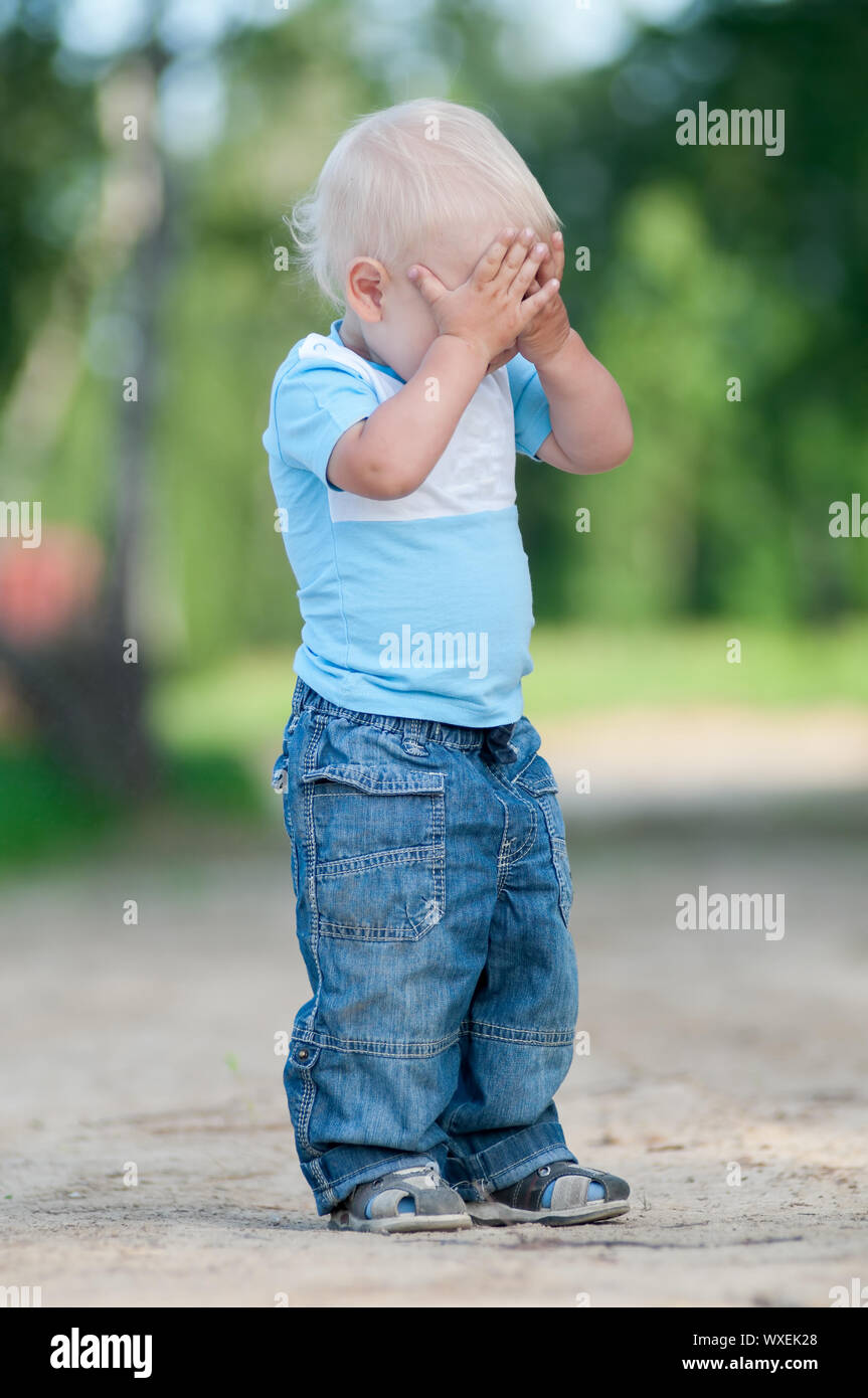 Portrait of a happy little boy in the green nature park. Outdoor Stock ...