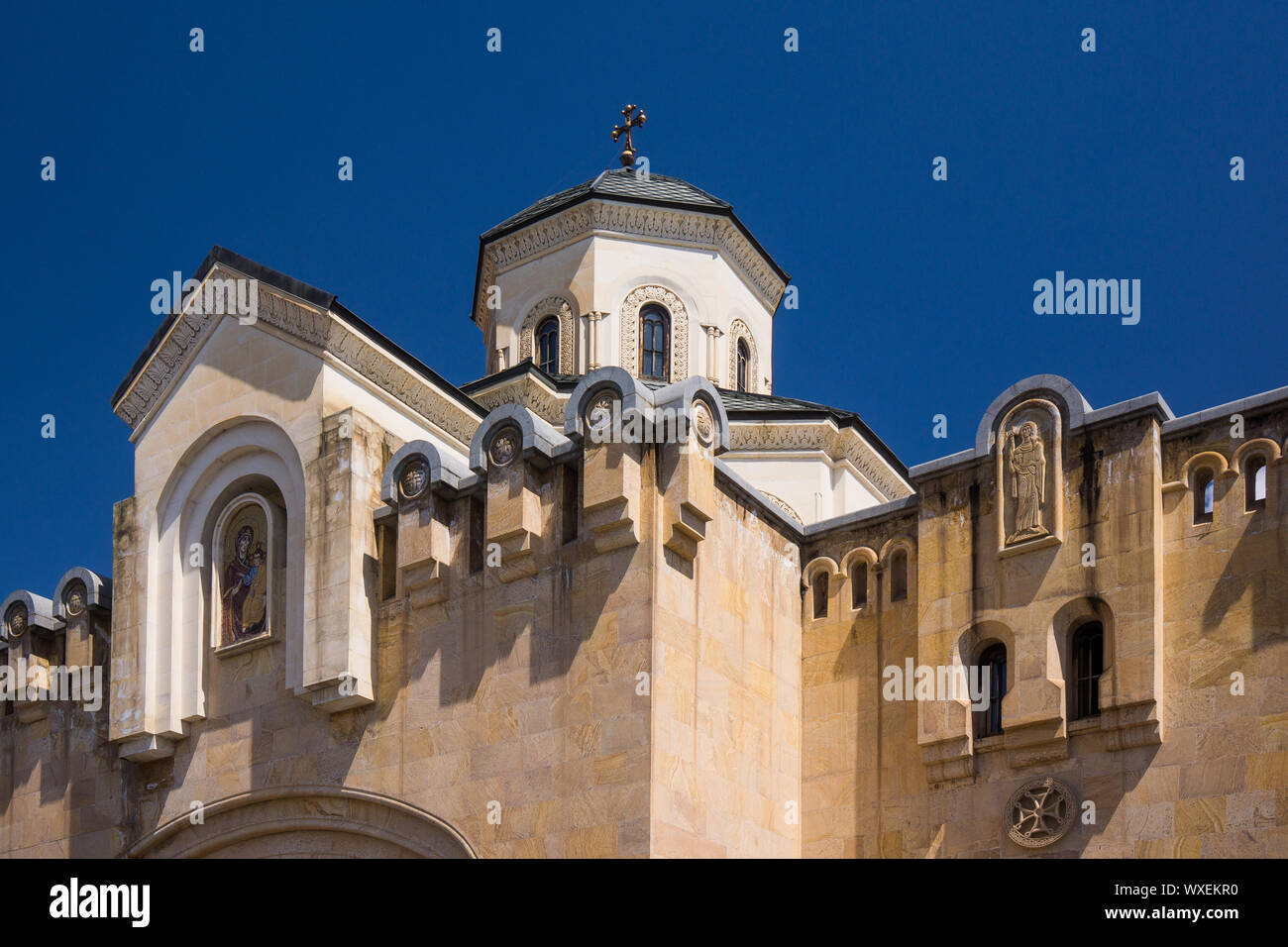 Tsminda Sameba Cathedral entrance Stock Photo - Alamy