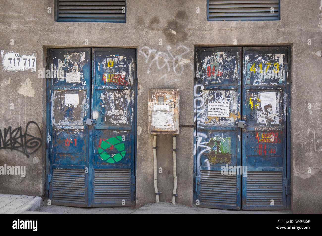 iron gates covered with spray paint street artists Stock Photo - Alamy