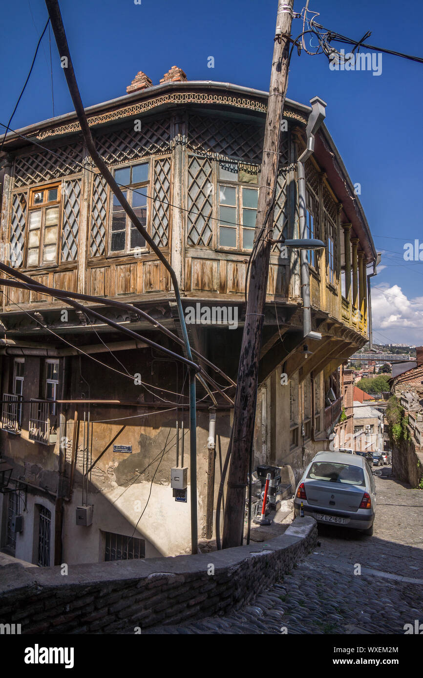 wooden house in tbilisi with street and blue sky Stock Photo - Alamy