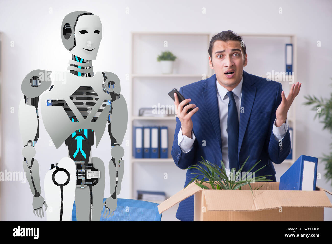 Concept of robots replacing humans in offices Stock Photo - Alamy