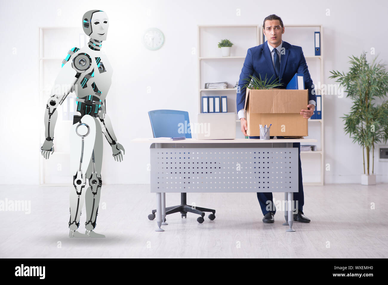 Concept of robots replacing humans in offices Stock Photo - Alamy