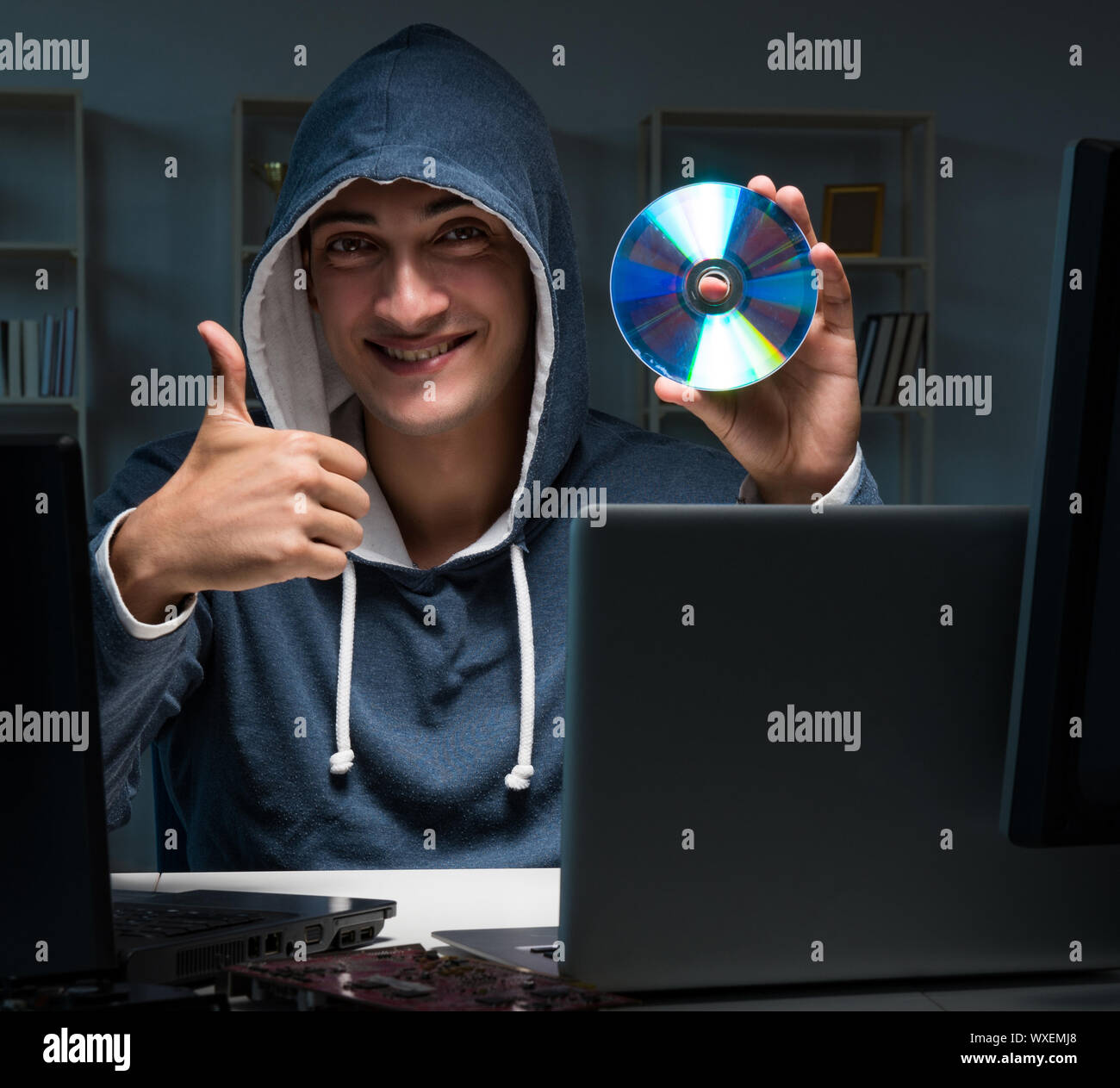 Hacker hacking computer at night Stock Photo - Alamy