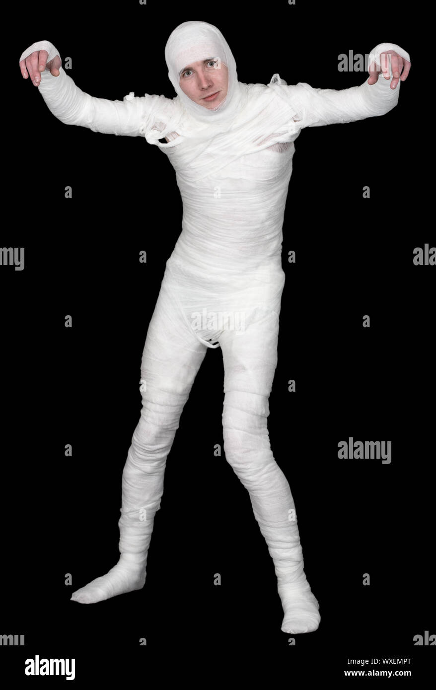 The mummy in bandage upright on a black background Stock Photo - Alamy
