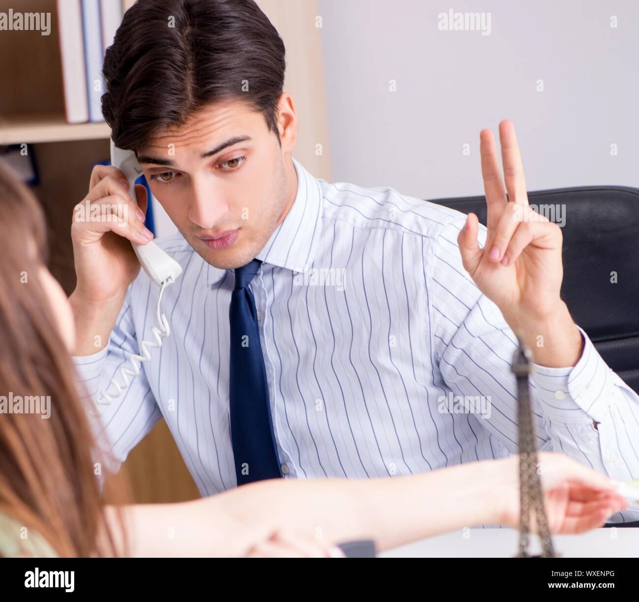 Male travel agent with customer in agency Stock Photo - Alamy